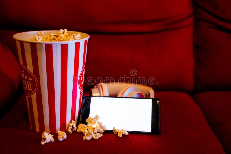 Mobile Phone with Empty White Bright Screen with Popcorn Bucket on the ...
