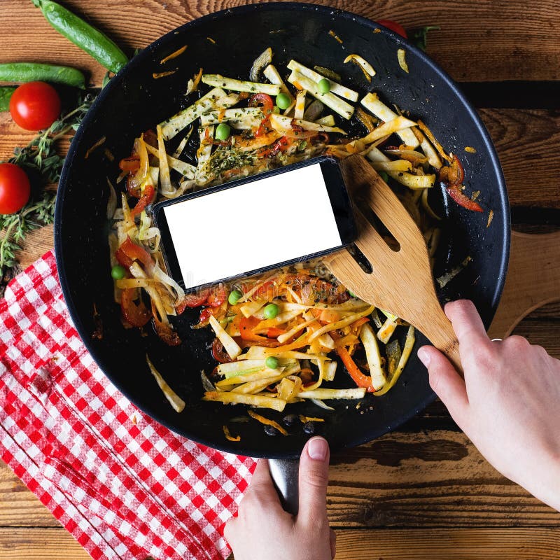 Mobile Phone and Fried Vegetables in the Pan, Cooking at Home Stock ...