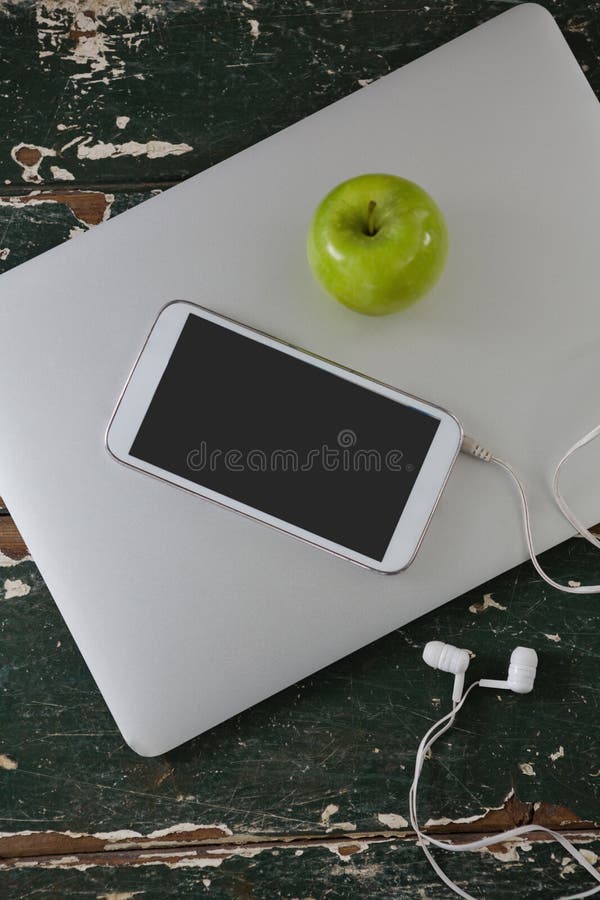 Mobile Phone and Green Apple on Laptop Stock Image - Image of ...