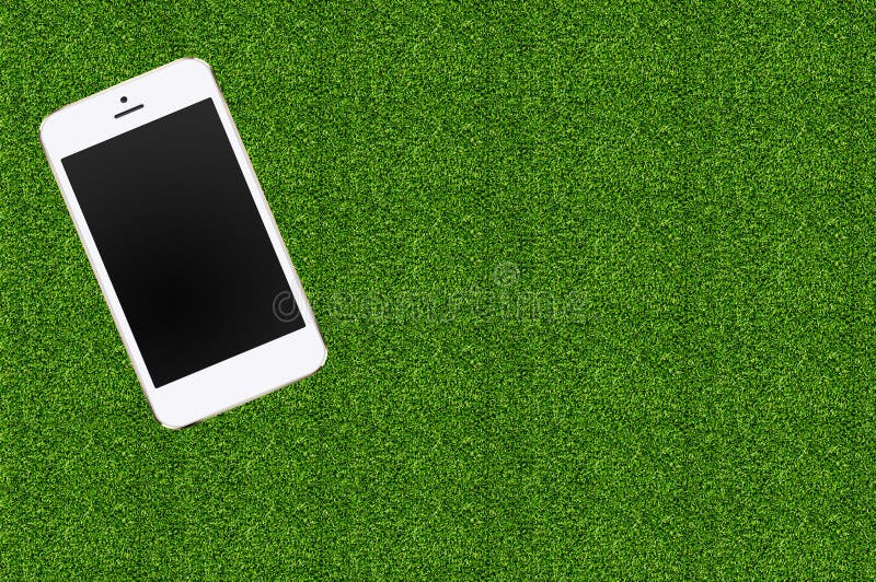 Mobile Phone in the Green Grass Stock Image - Image of closeup ...