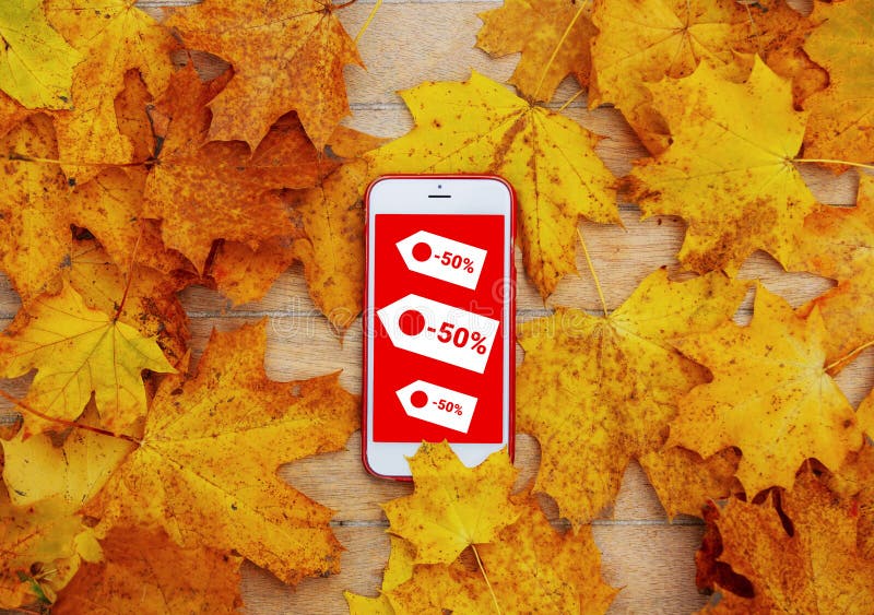 Mobile Phone with Green Screen Next To Autumn Leaves on a Table Stock ...
