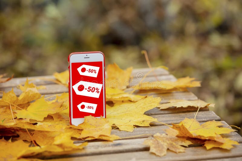 Mobile Phone with Green Screen Next To Autumn Leaves on a Table Stock ...