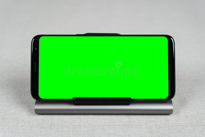 A Mobile Phone with a Green Screen Stands Horizontally Stock Photo ...