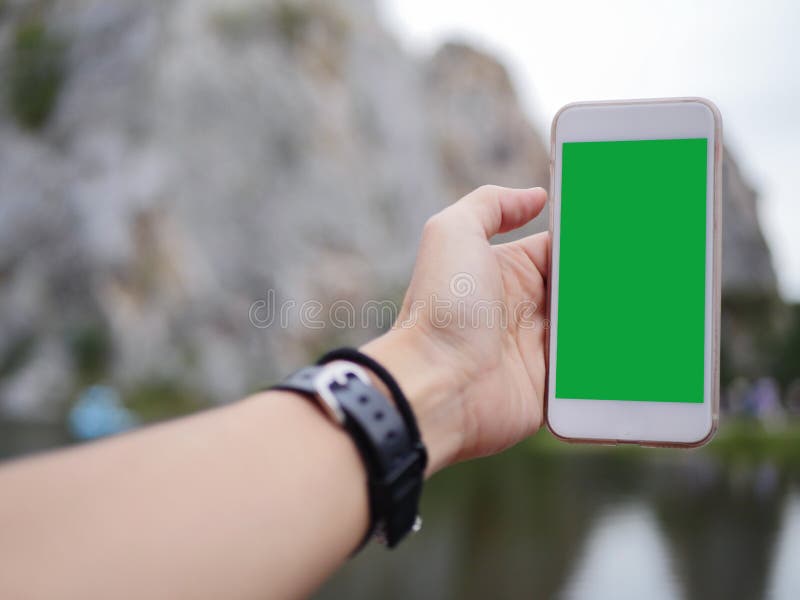 Mobile Phone in Hand with Green Colour Screen Stock Photo - Image of ...