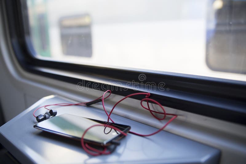 Mobile Phone and Headset on the Table in a Train Stock Image - Image of ...