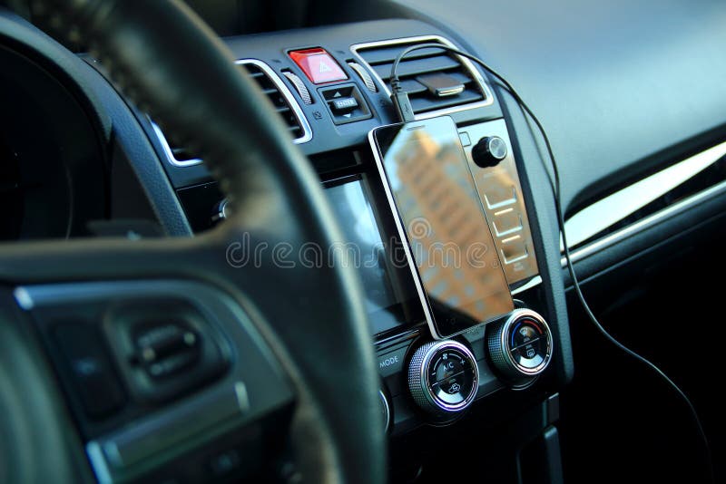 Mobile Phone Inside the Car at the Charging Process by Wire Inside the ...