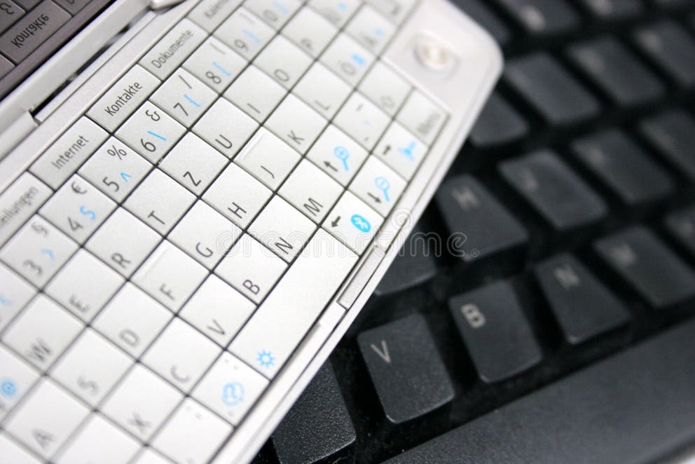 Mobile Phone Keypad and Computer Keyboard Stock Image - Image of ...