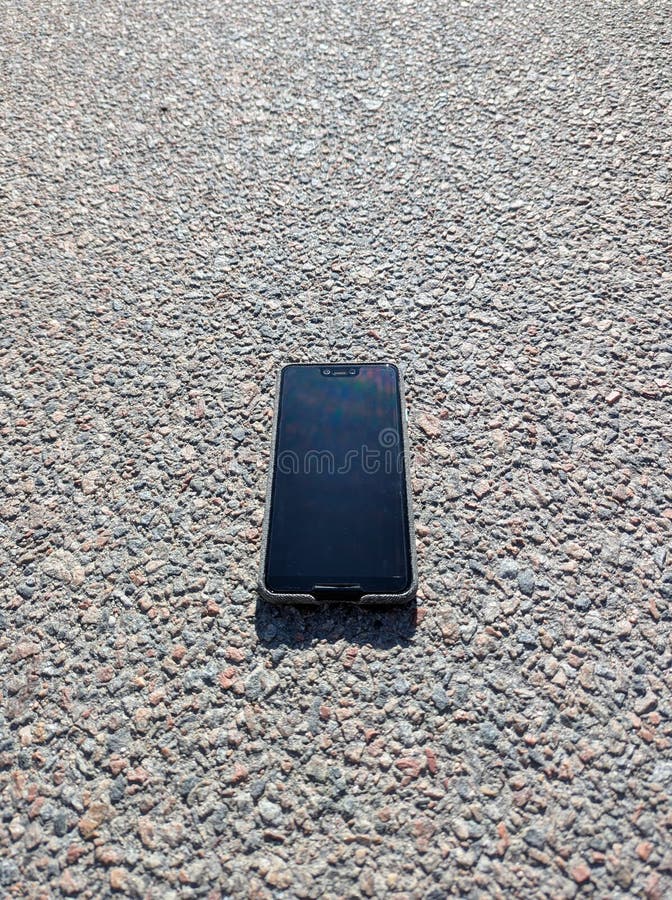 The Smartphone is Lying on the Asphalt Stock Photo - Image of ...