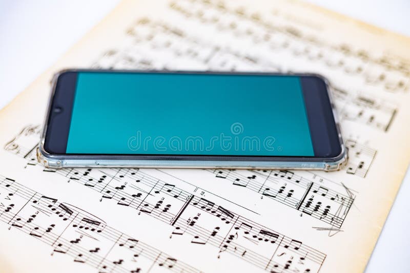 Mobile Phone Lies on a Sheet of Music Notes Stock Photo - Image of dead ...