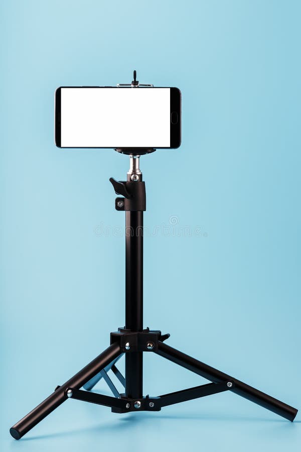 Mobile Phone Mounted on a Tripod with a White Display Free for Images ...