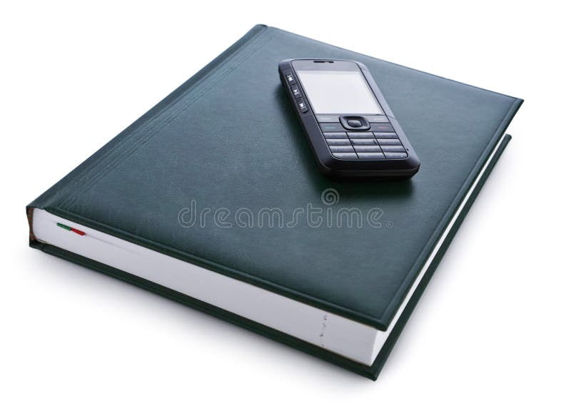 Mobile phone on a notebook stock image. Image of phone - 12464711