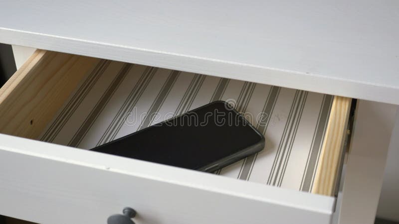 Mobile Phone in Open Drawer. Stock Video - Video of object, item: 290774131