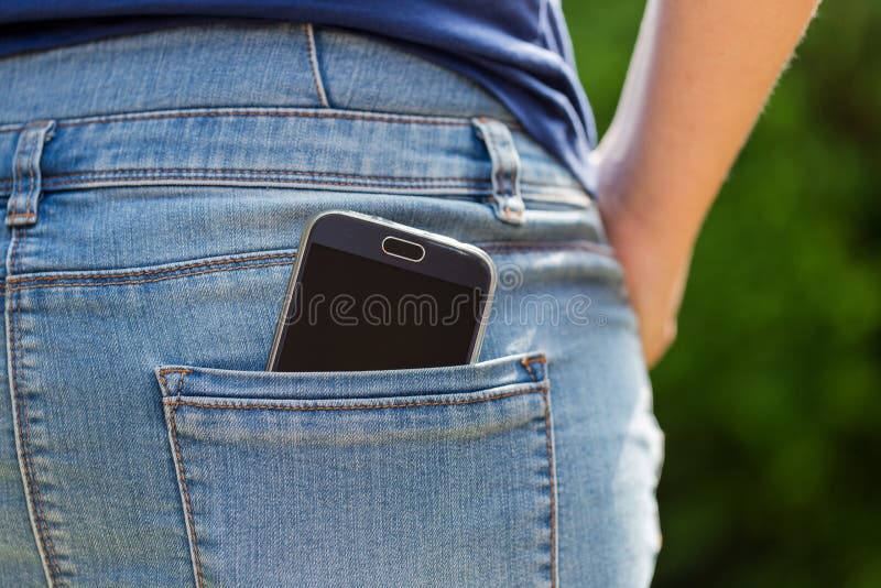 Mobile phone in pocket stock photo. Image of device, summer - 78102944