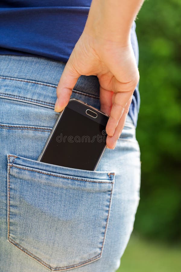 Mobile phone in pocket stock photo. Image of smartphone - 78103056