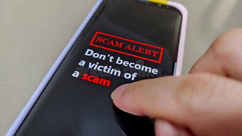A Mobile Phone Showing the Message Don T Become a Victim of a Scam ...