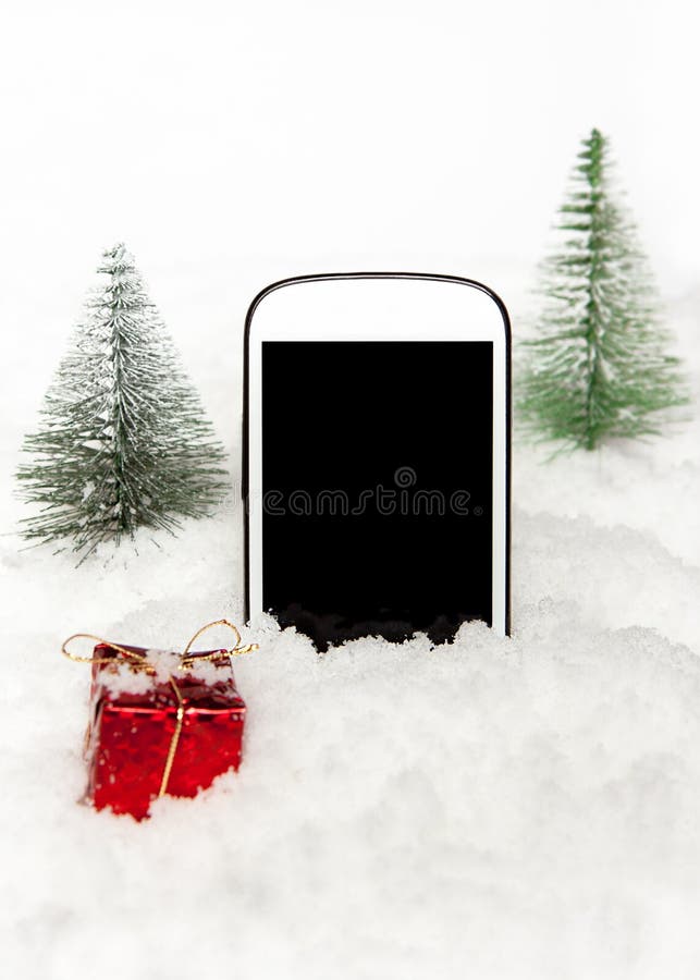 Mobile Phone in the Snow Next To the Gift. Stock Image - Image of cold ...
