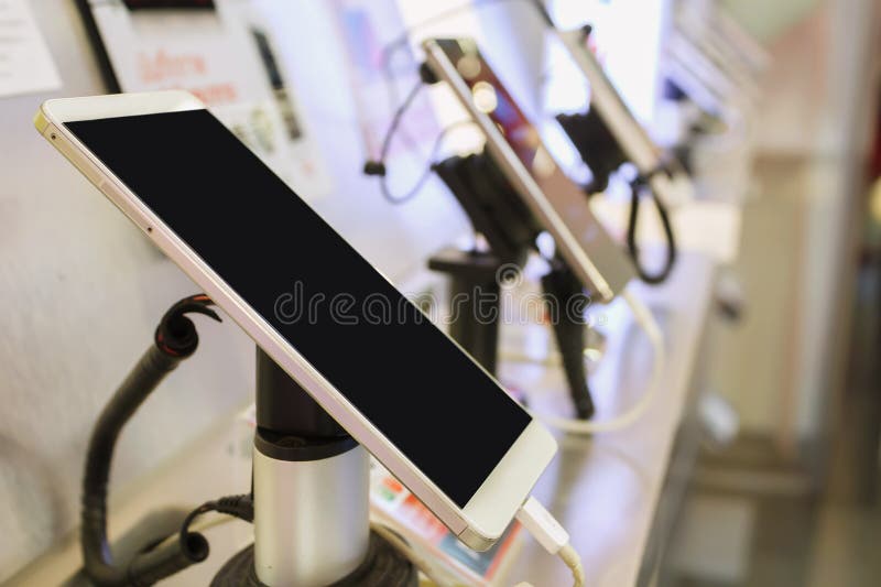Showcase with Smartphones in the Modern Electronics Store. Many ...