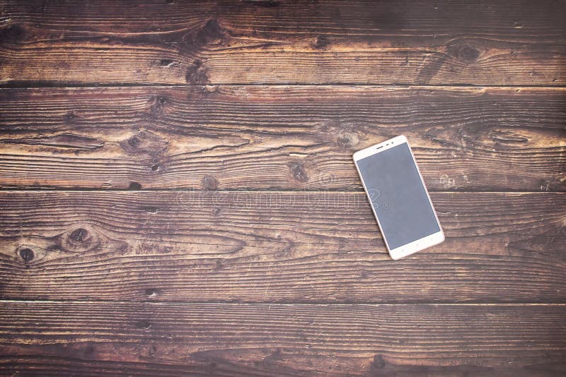 Mobile phone on the table stock photo. Image of laptop - 144108436