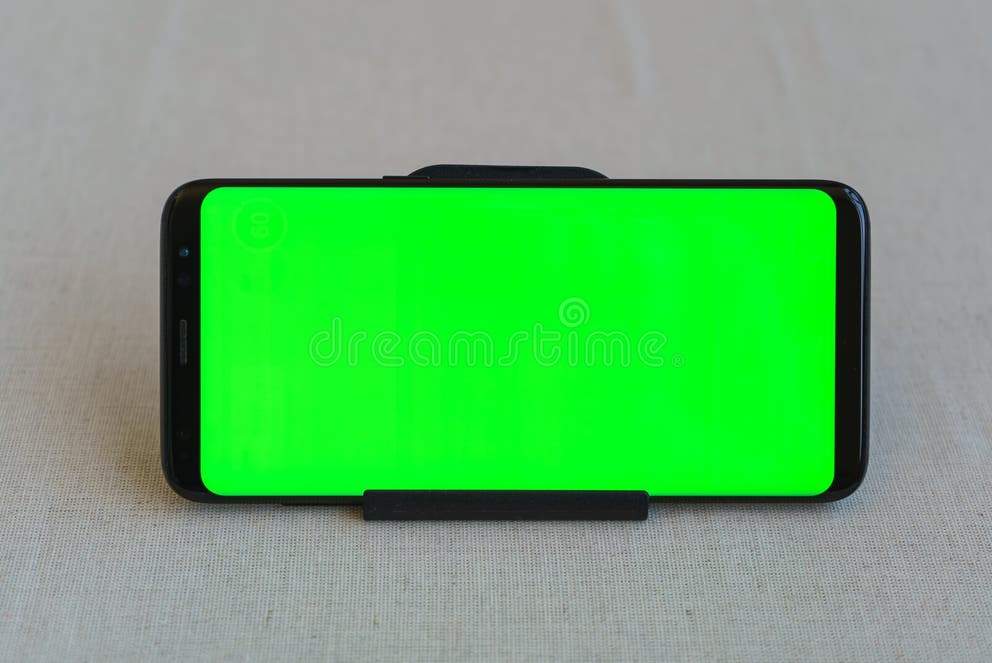 Mobile Phone on Table Horizontally with Green Screen Stock Photo ...