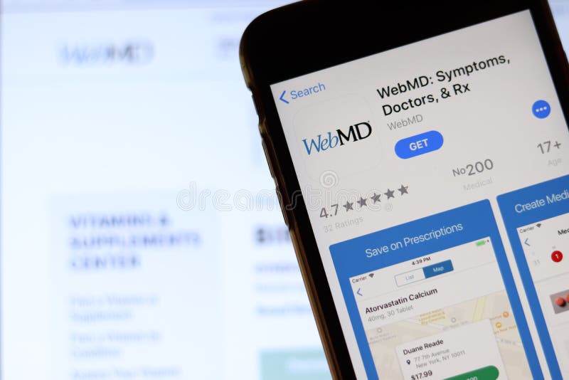 Mobile Phone with WebMD Icon on Screen Close Up with Website on Laptop ...