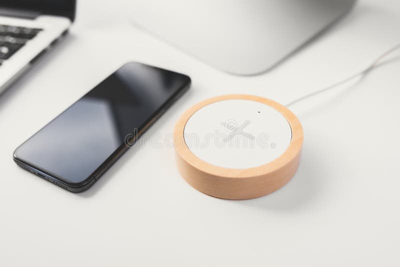 Mobile Phone and Wireless Charger on Office Table Stock Photo - Image ...