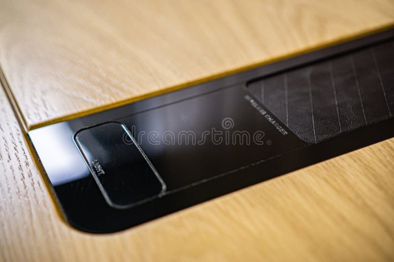 Mobile Phone with Wireless Charger on Table. Modern Workplace Accessory ...