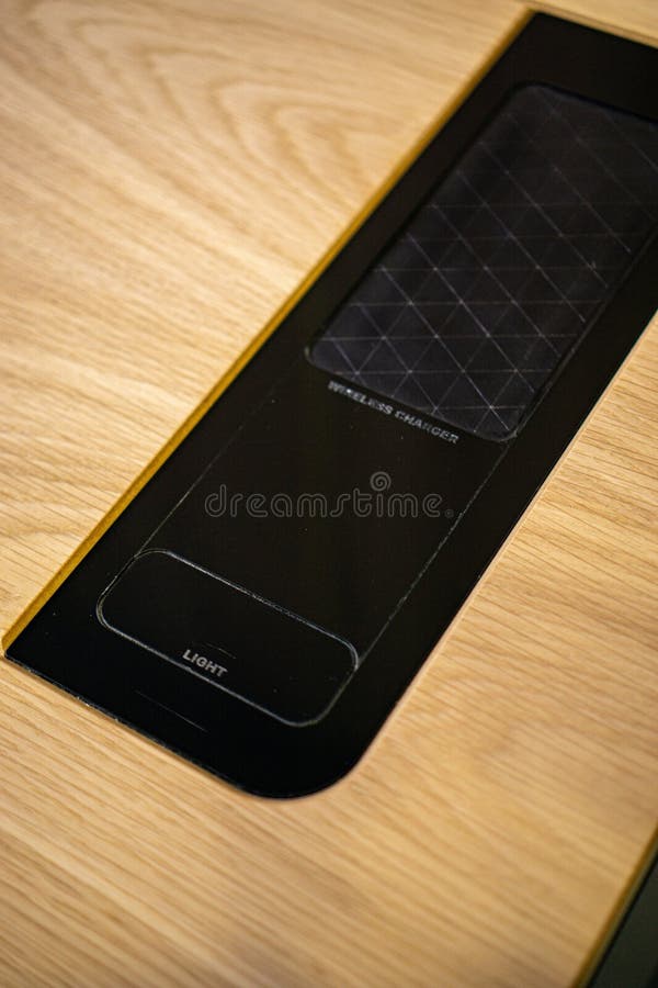 Mobile Phone with Wireless Charger on Table. Modern Workplace Accessory ...