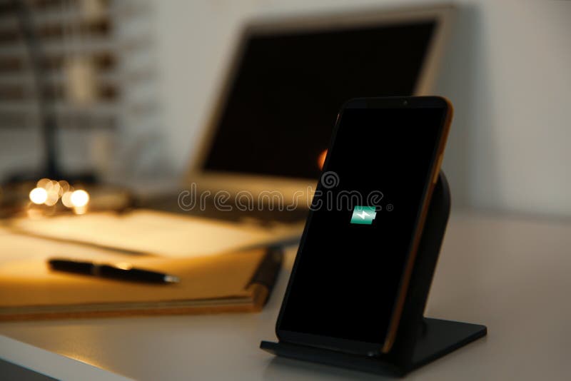 Mobile Phone with Wireless Charger on Table. Modern Accessory Stock ...