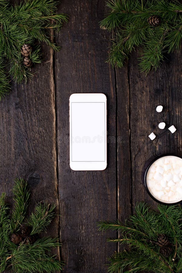 Mobile Phone on a Wooden Table with a Christmas Tree and Cocoa Stock ...