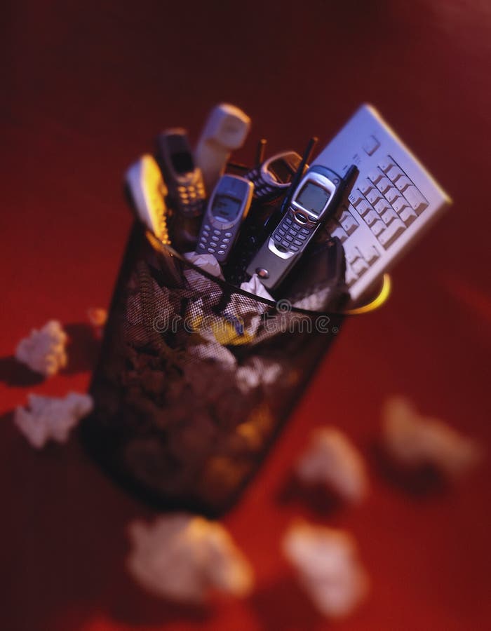 Mobile Phones and Computer Keyboard in Waste Bin Stock Photo - Image of ...
