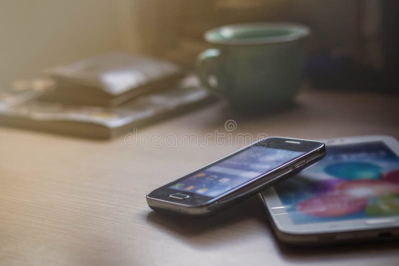 Mobile phones on the desk. stock photo. Image of diary - 77911736