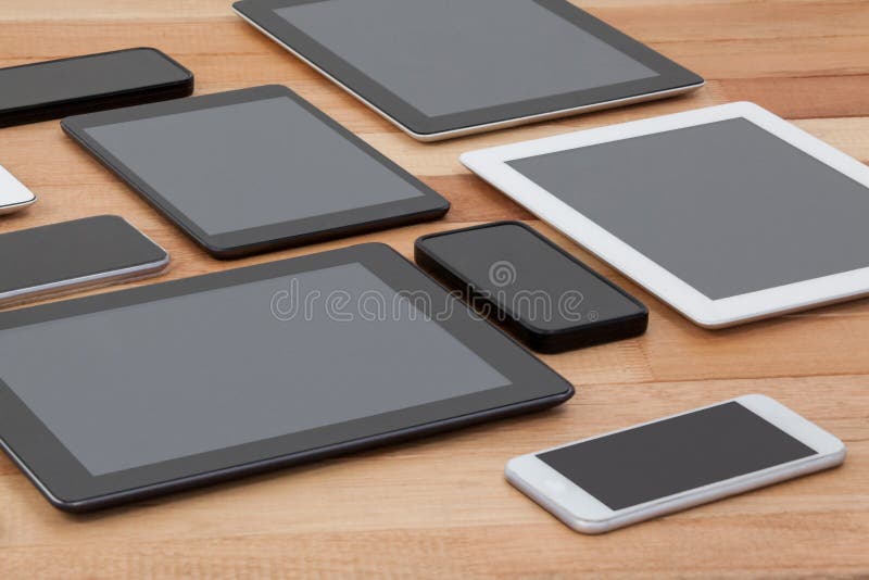 Mobile Phones and Digital Tablets on Table Stock Photo - Image of ...