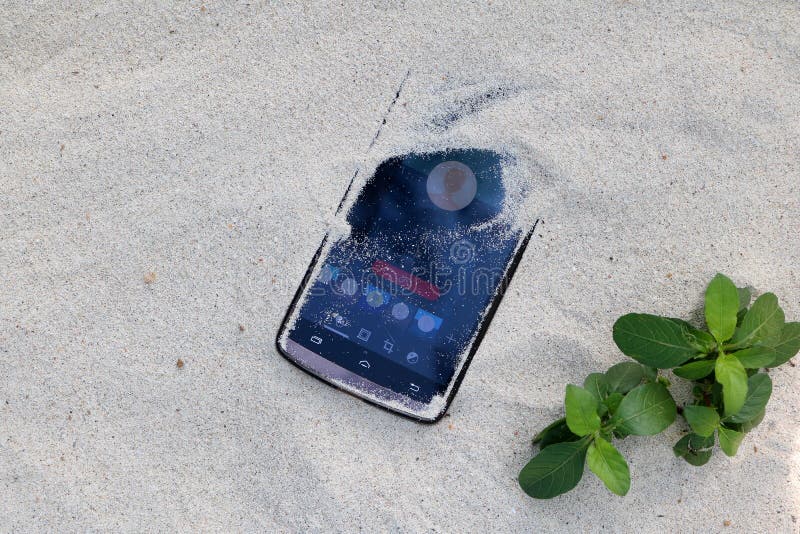Mobile phones in the sand. stock photo. Image of outdoor - 79412628