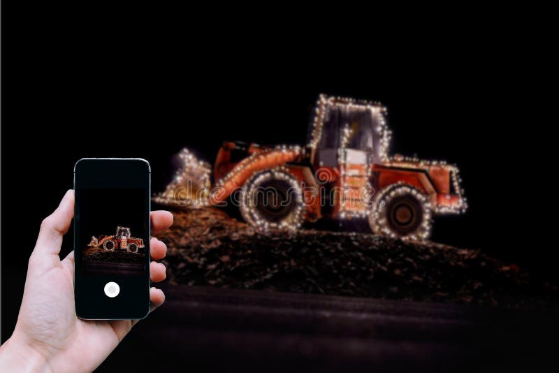 Mobile Picture of a Blurred Wheel Loader Decorated with Lights at ...