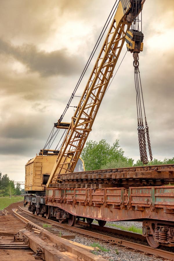 Railway Crane with a Platform Under the Boom Stands on the Railway ...