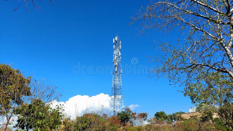 Mobile Signal Tower with Blue Sky and White Clouds Background Stock ...