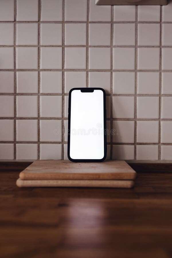 Mobile Smart Phone on Kitchen Counter with Blank White Mockup Screen ...