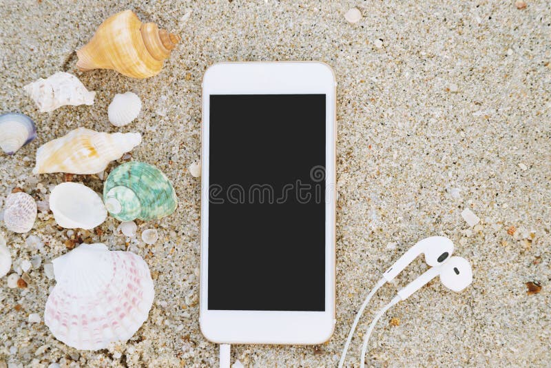 Mobile Smart Phone with Screen Empty and Headphone Lying on the Beach ...