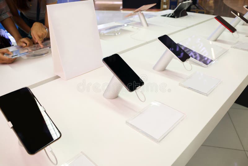 Mobile Smartphone Showcase in Store Stock Image - Image of device ...