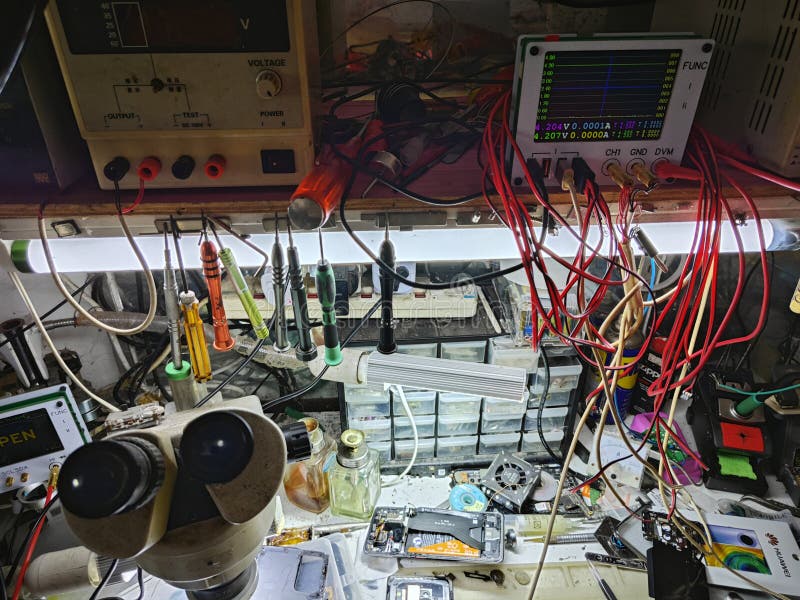 Mobile Technician Inside His Workshop Repairing and Servicing the ...