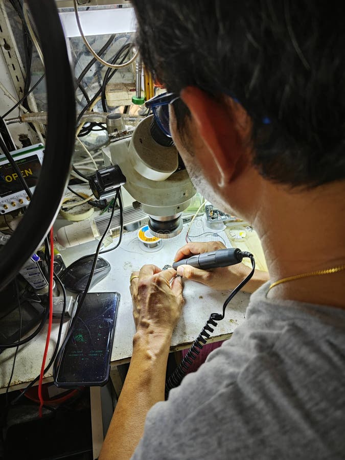 Mobile Technician Inside His Workshop Repairing and Servicing the ...