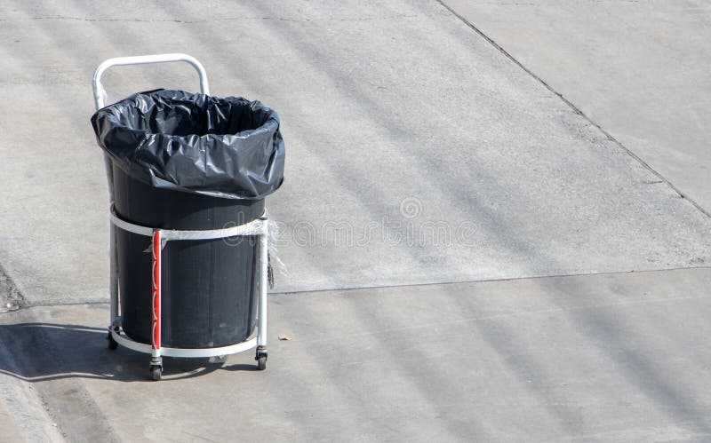 A Mobile Trash Can on Wheels Stands on a Sunny Street Stock Photo ...