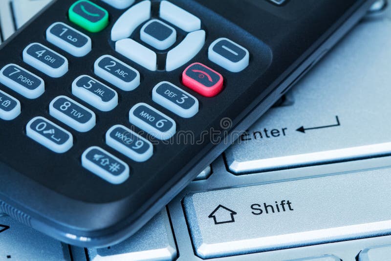 Phone on Keyboard in Blue Tint Stock Photo - Image of digital, business ...