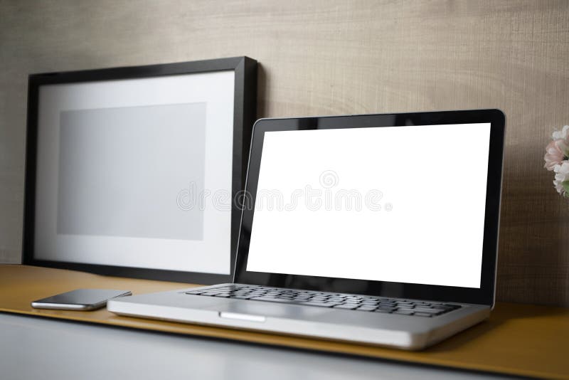 Computer Laptop with Blank Screen, Smart Phone and Empty Frame on ...