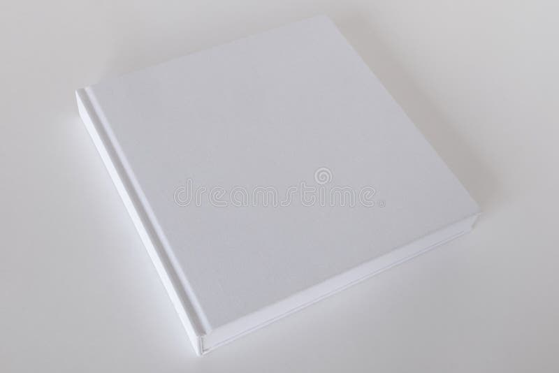 Mockup of Closed Blank Square Book at White Textured Paper Stock Photo ...