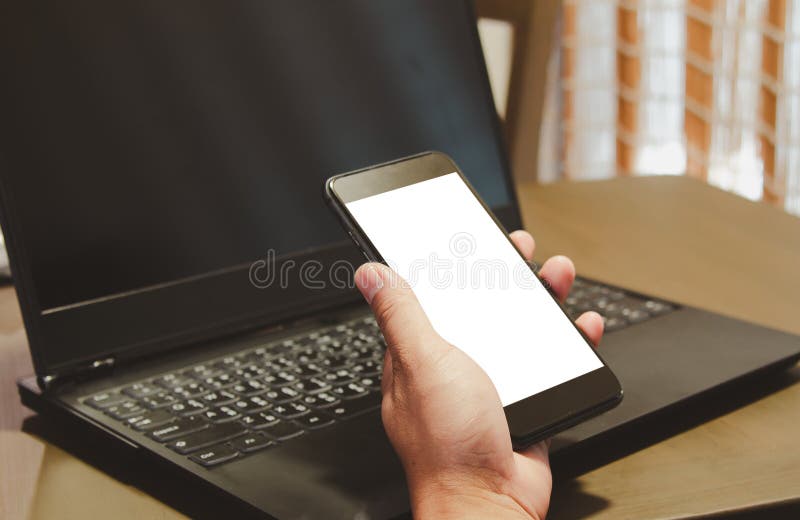 Mock Up Hand Holding Smartphone White Blank Screen and Computer Laptop ...