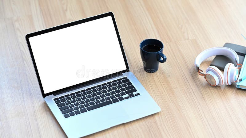 A Laptop Computer, Coffee Cup, Headphone and Notebook on Wooden Floor ...
