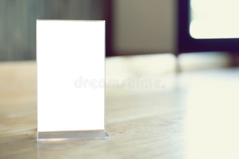 Mock Up Menu Frame Standing on Wood Table in Bar Restaurant Cafe. Space ...