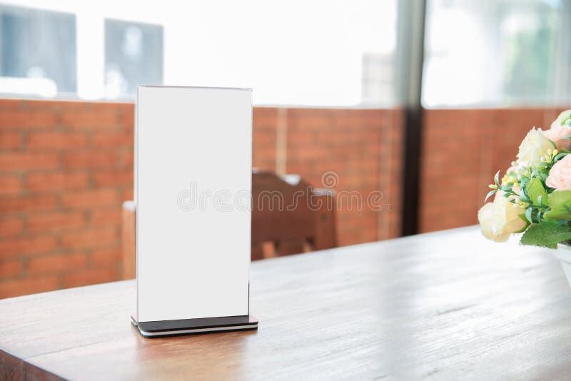 Mock Up Menu Frame Standing on Wood Table in Coffee Shop. Stock Image ...