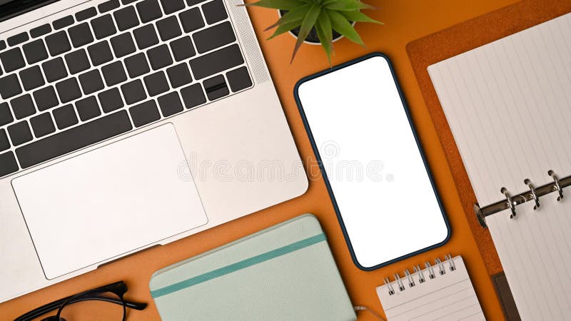 Mobile Phone, Laptop Computer and Notebook on Brown Leather. Stock ...